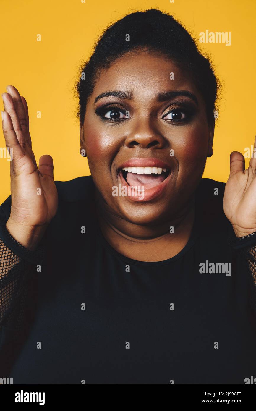 closeup portrait of a young adult black woman in shock with mouth open ...
