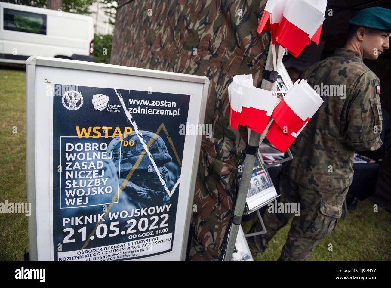 A poster that says Join the voluntary basic military service is seen at ...