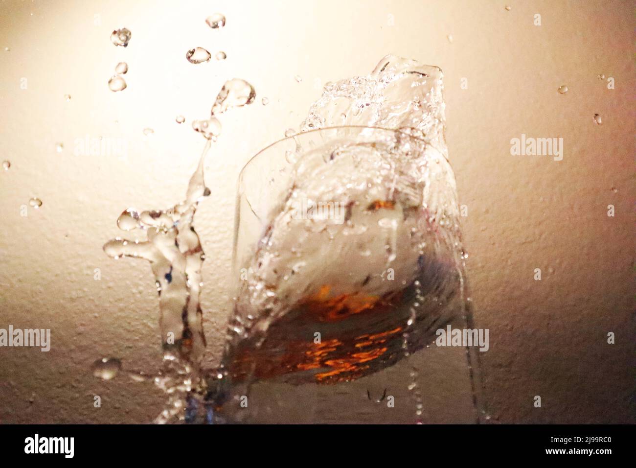 Orange Splashing Glass Vase Stock Photo - Alamy