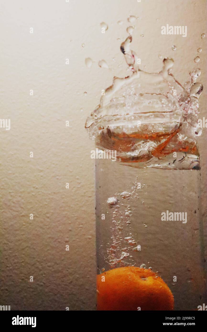 Orange Splashing Glass Vase Stock Photo - Alamy