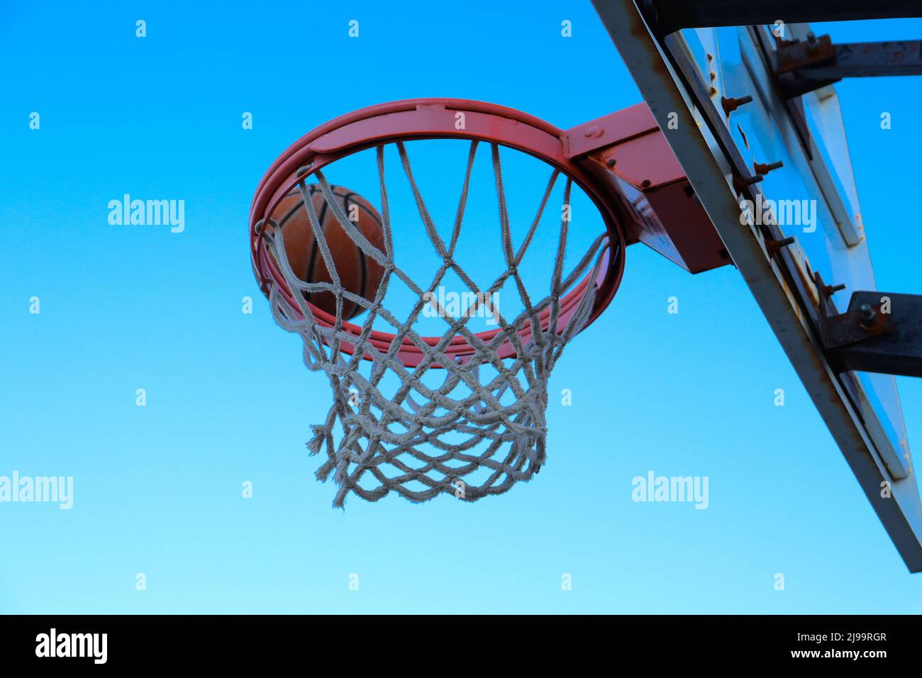 Basketball hoop against the blue sky Stock Photo - Alamy