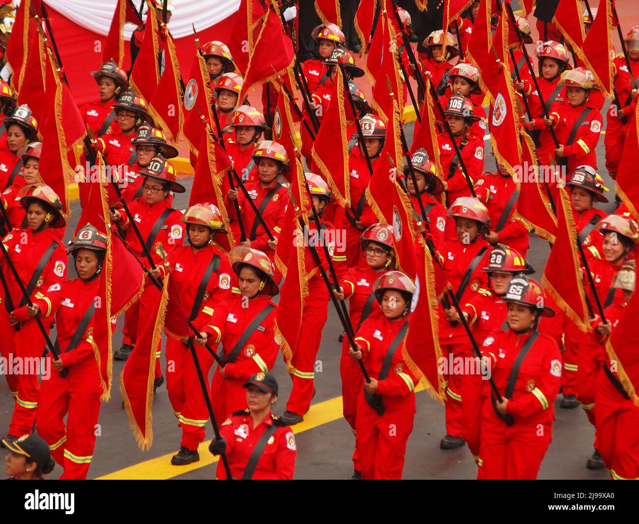Battalion of female volunteer firefighters marching in the parade for ...