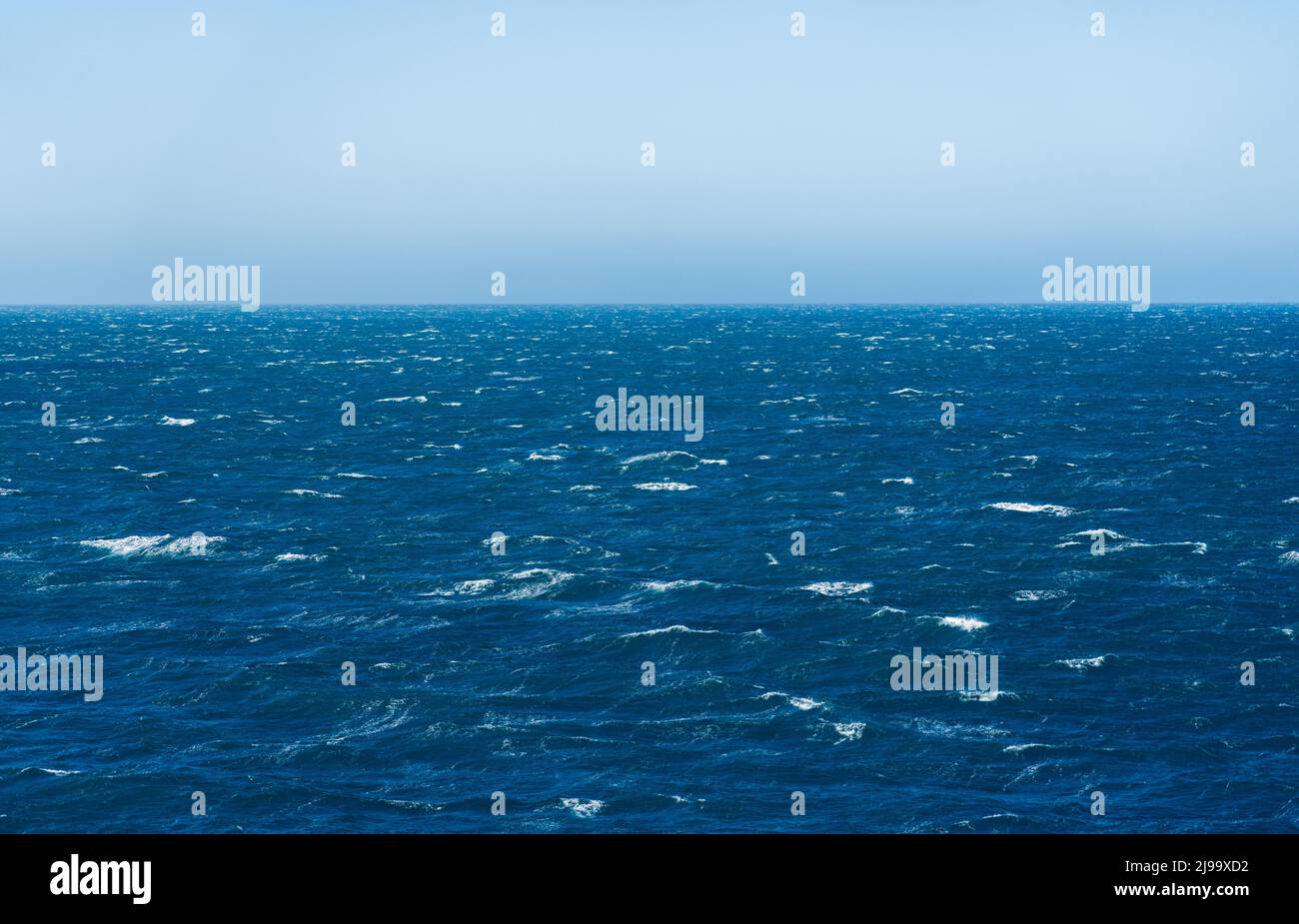 Rough sea surface on windy day with white caps and splashing background ...