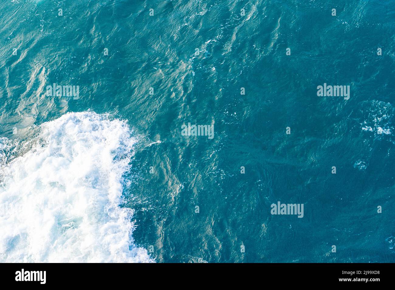 Sea surface on windy day with white caps and splashing background Stock ...
