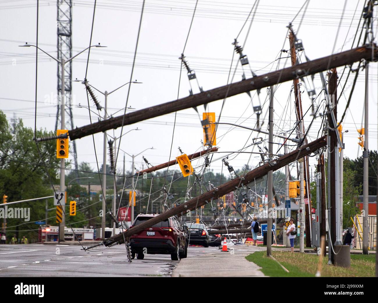 Ottawa, Can. 21st May, 2022. A vehicle is seen among downed power lines ...
