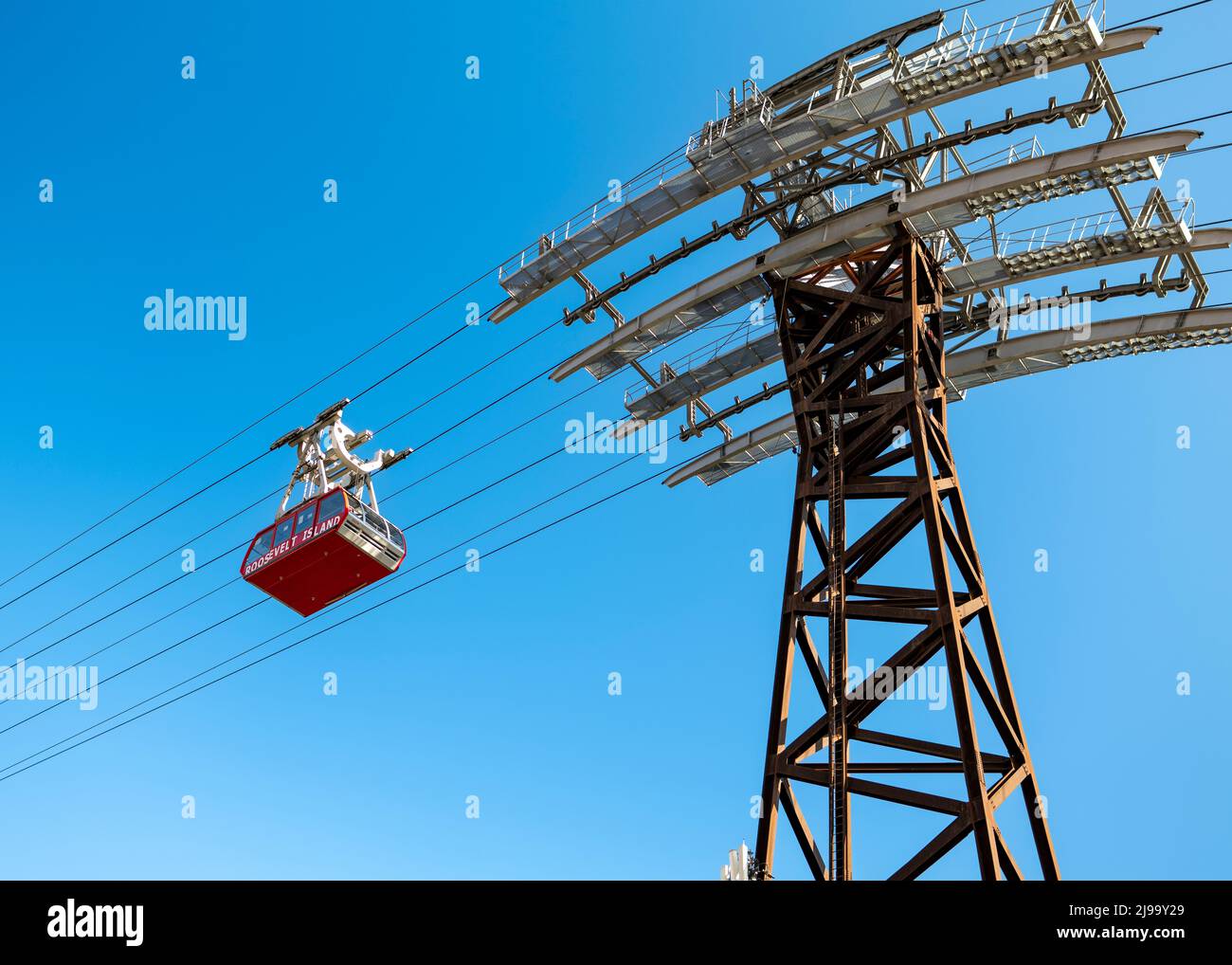 Cable car in New York City above road Stock Photo - Alamy