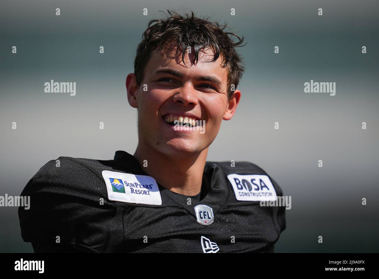 B.C. Lions quarterback Nathan Rourke smiles while talking with his dad ...