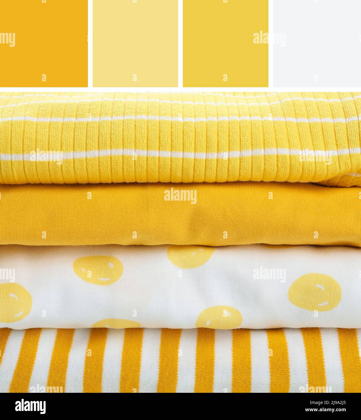 Stack of stylish clothes, closeup. Different color patterns Stock Photo ...