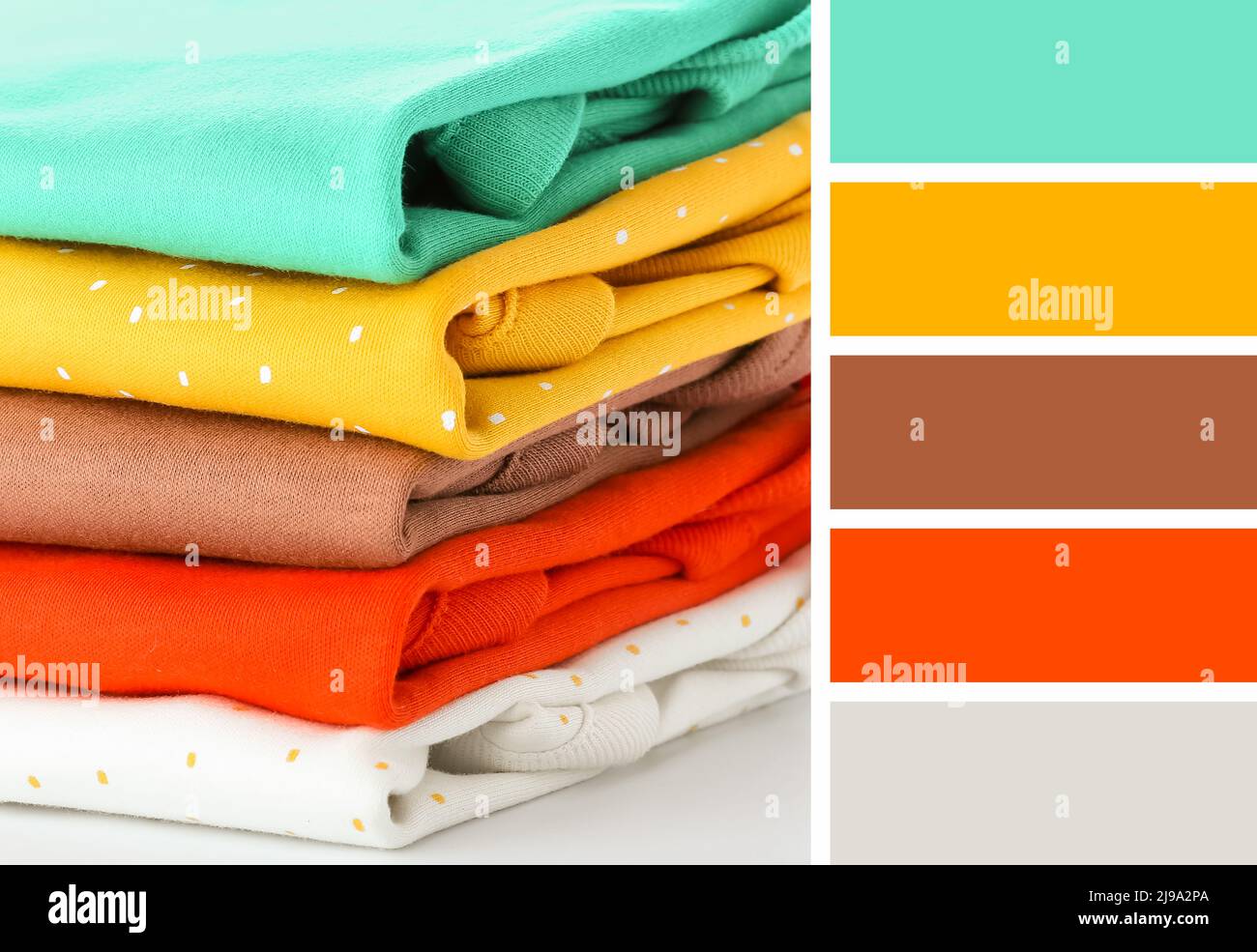 Stack of baby clothes, closeup. Different color patterns Stock Photo ...