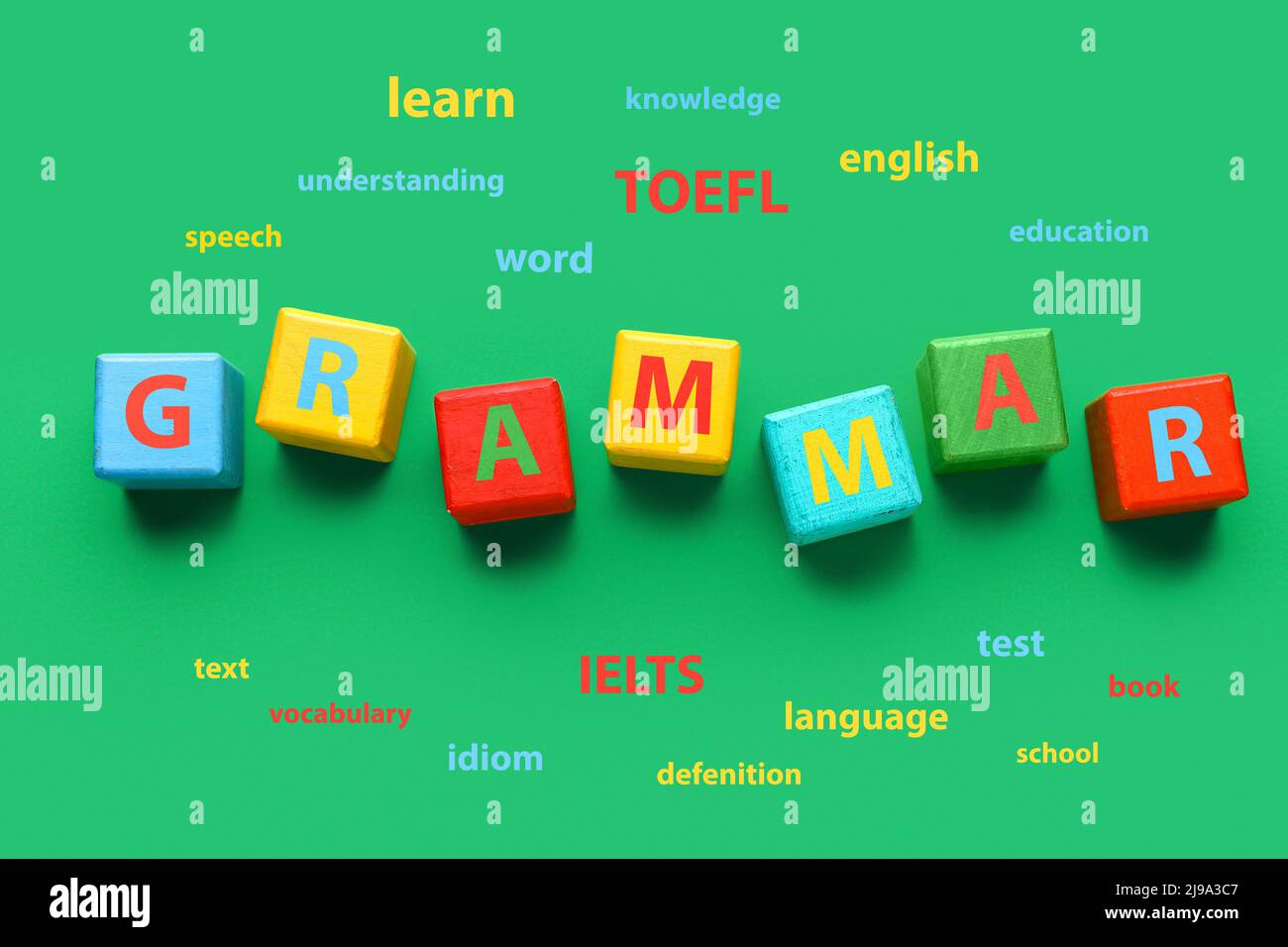 Text GRAMMAR made of wooden cubes and different words on green ...