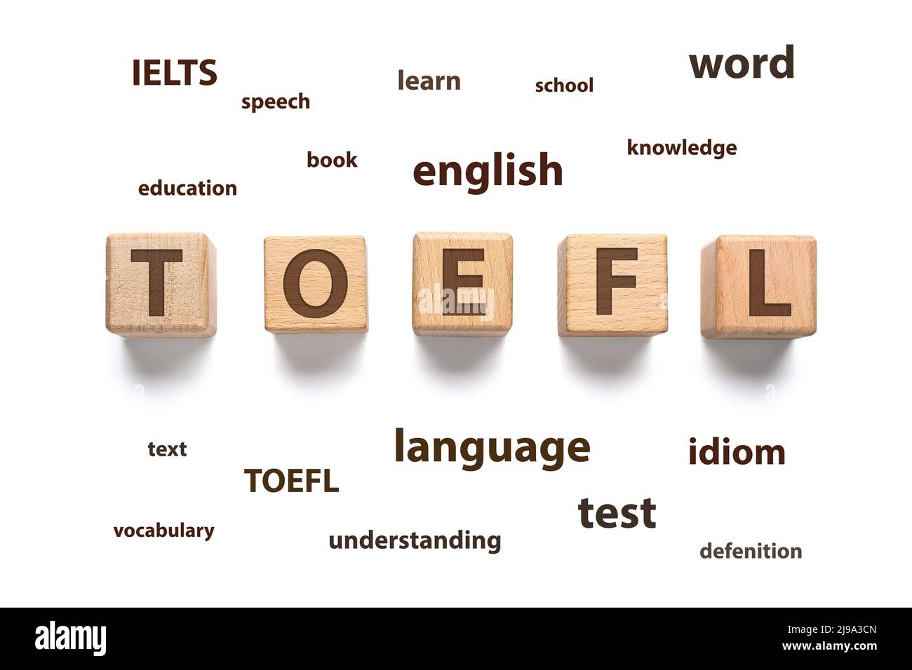 Text TOEFL made of wooden cubes and different words on white background ...