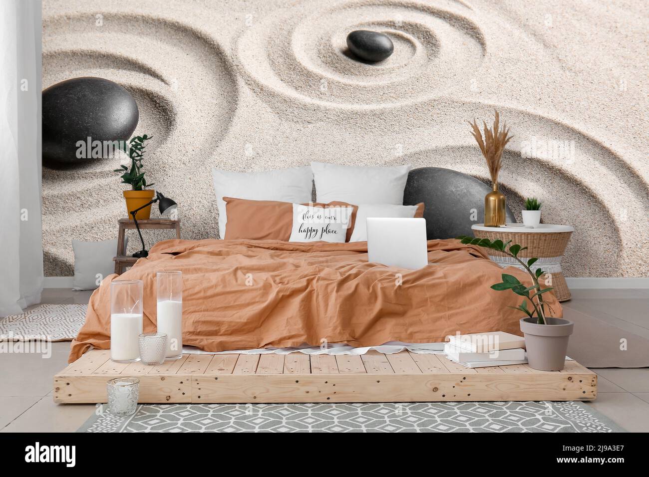 Stylish interior of modern bedroom with printed spa stones and sand on ...