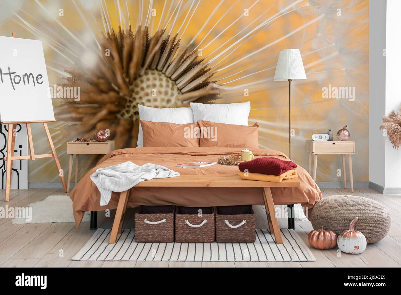 Stylish interior of bedroom with printed beautiful blowball on wall ...