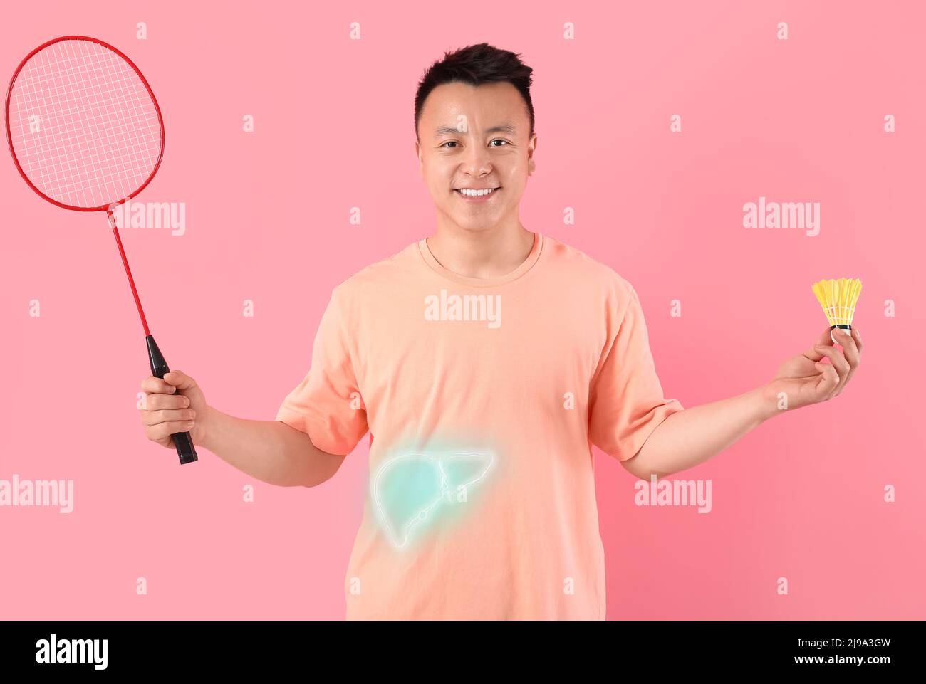 Sporty Asian badminton player with healthy liver on pink background ...
