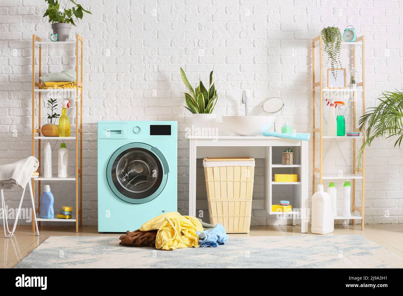 Interior of modern bathroom with turquoise washing machine Stock Photo ...