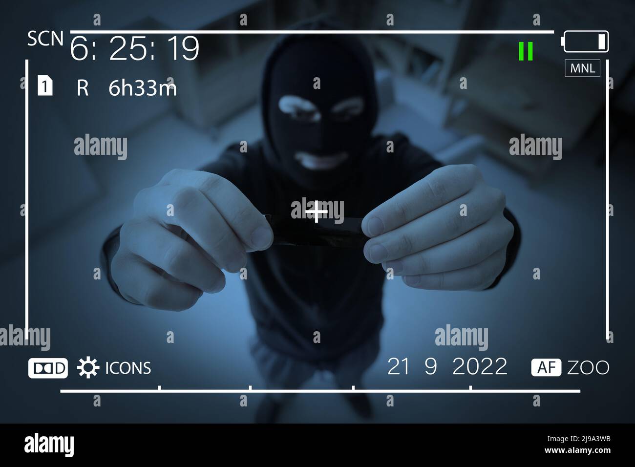 Thief putting sticky tape onto surveillance camera Stock Photo - Alamy