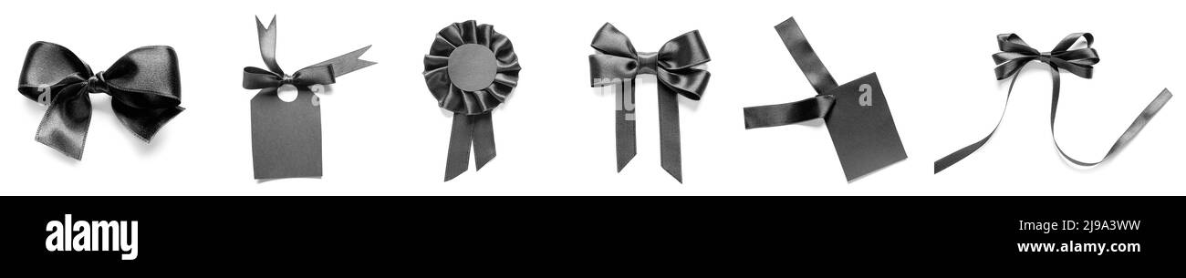 Set of black ribbon bows with tags on white background Stock Photo - Alamy