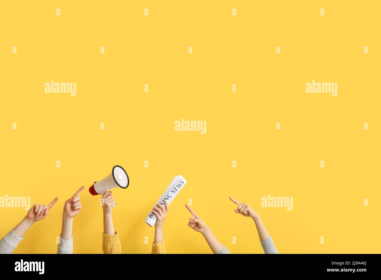 People pointing at megaphone and newspaper on yellow background Stock ...