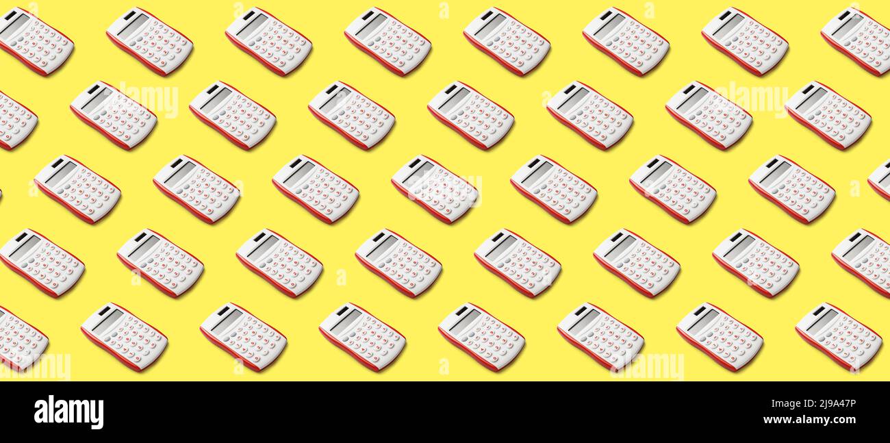 Many calculators on yellow background. Pattern for design Stock Photo ...