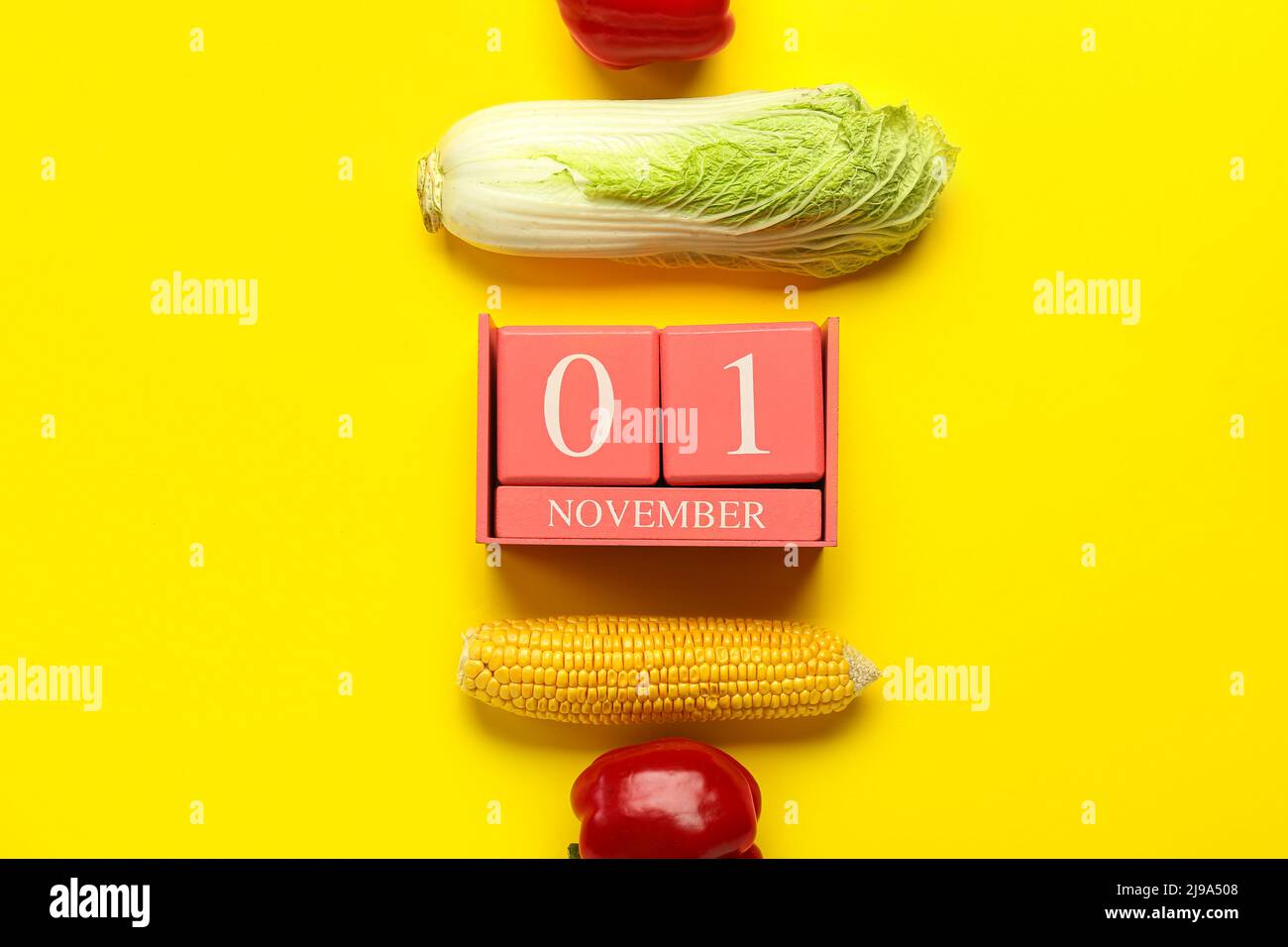 Chinese cabbage, bell peppers, corn cob and cube calendar with date ...