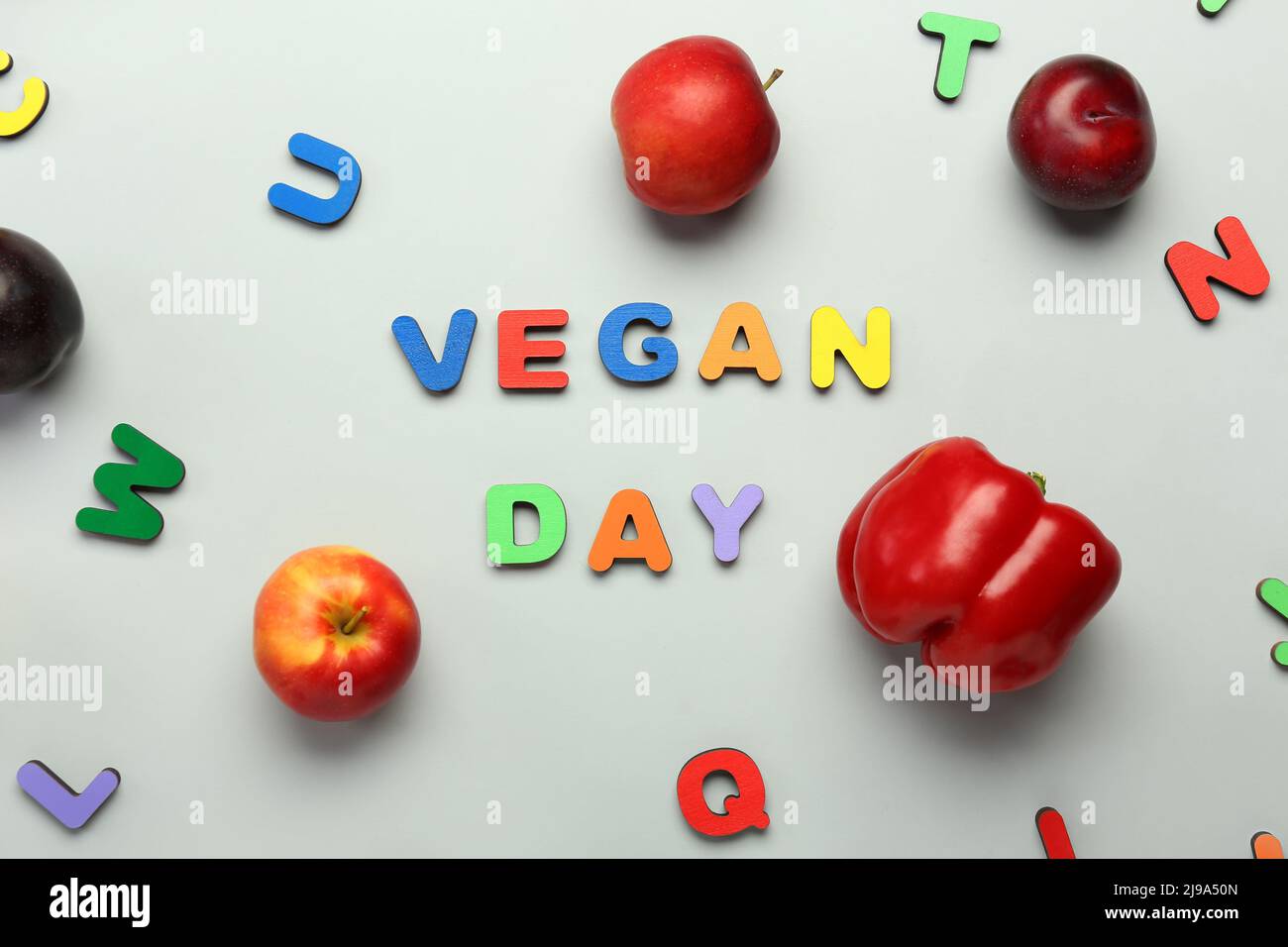 Fruits, vegetables, letters and text VEGAN DAY on grey background Stock ...