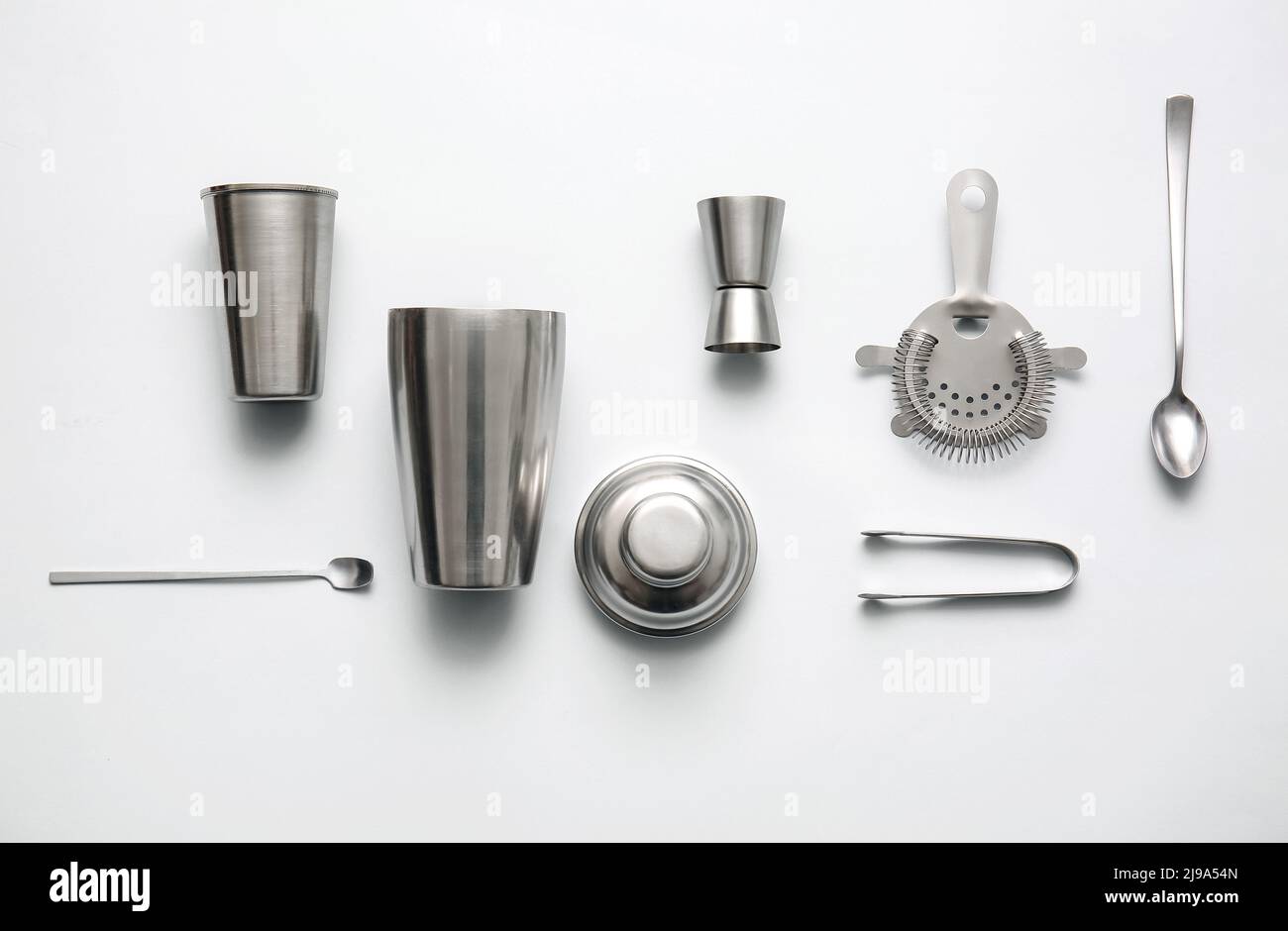 Bartender tools on grey background Stock Photo - Alamy