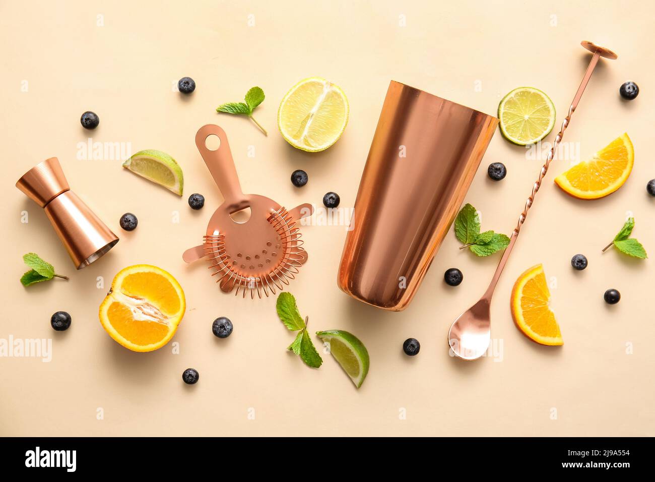 Bartender tools and cocktail ingredients on color background Stock ...