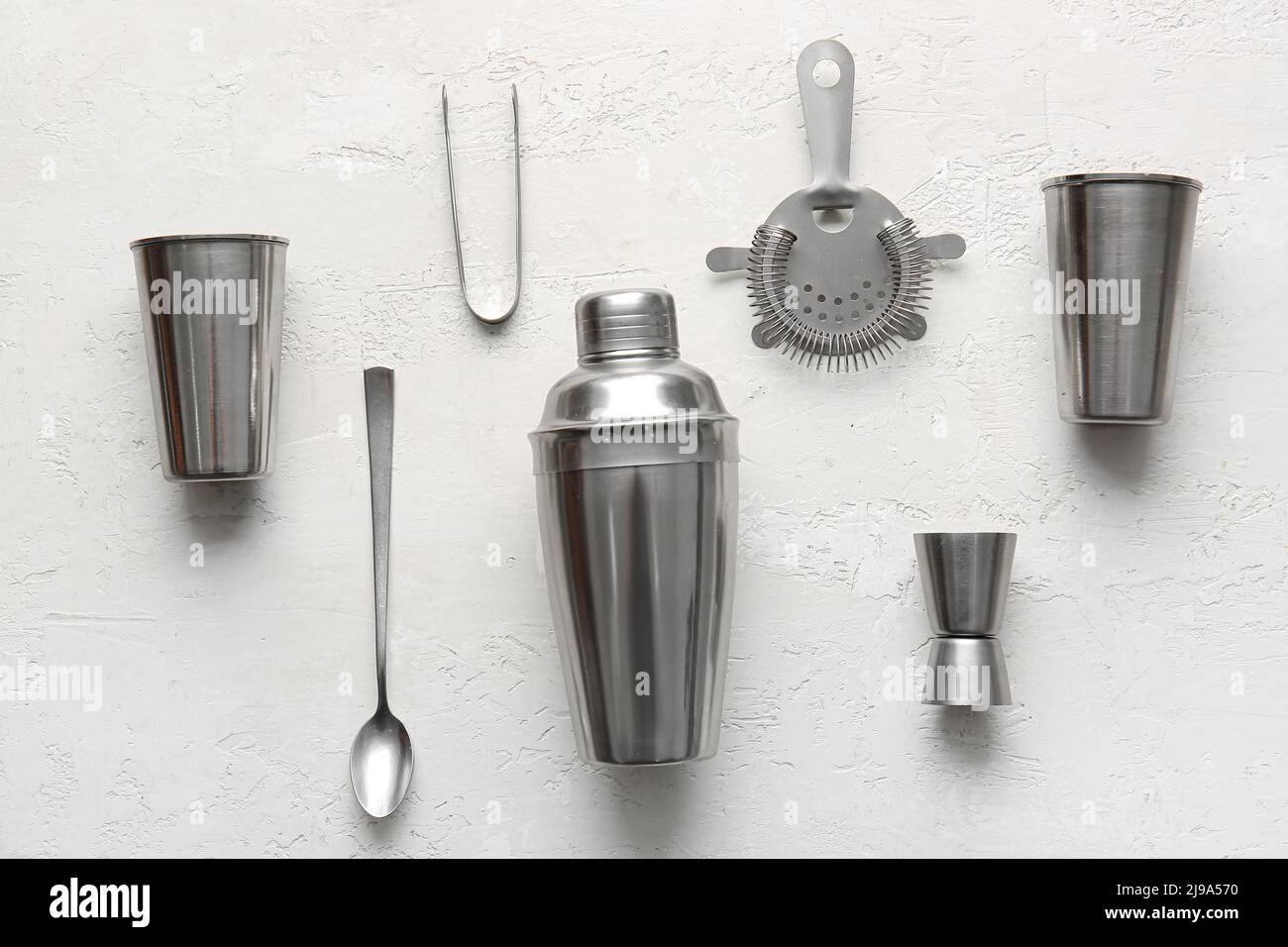 Set of bartender tools on light background Stock Photo - Alamy