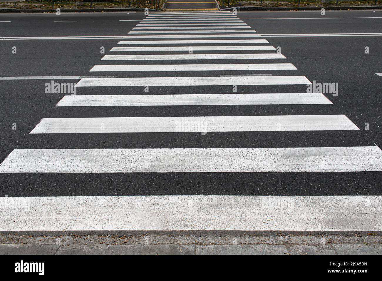 Pedestrian crossing on asphalt road Stock Photo - Alamy