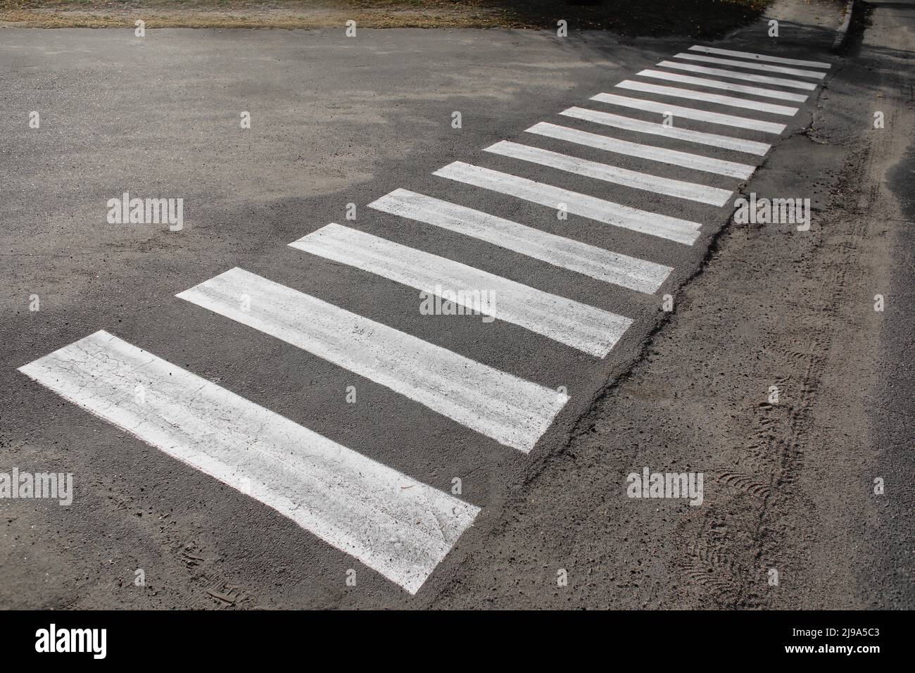 New zebra crossing on road Stock Photo - Alamy