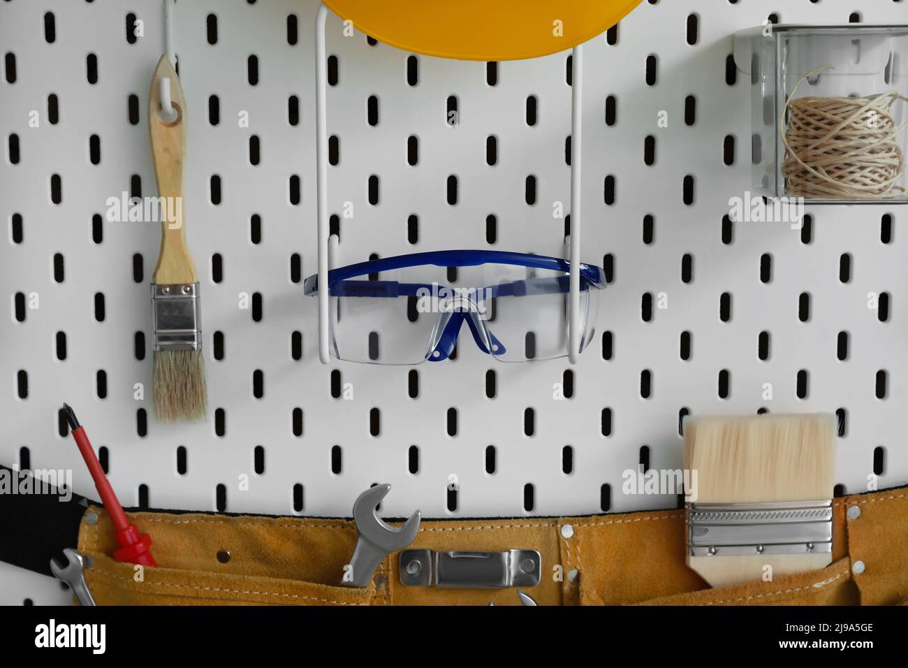 Closeup view of pegboard with modern tools Stock Photo - Alamy