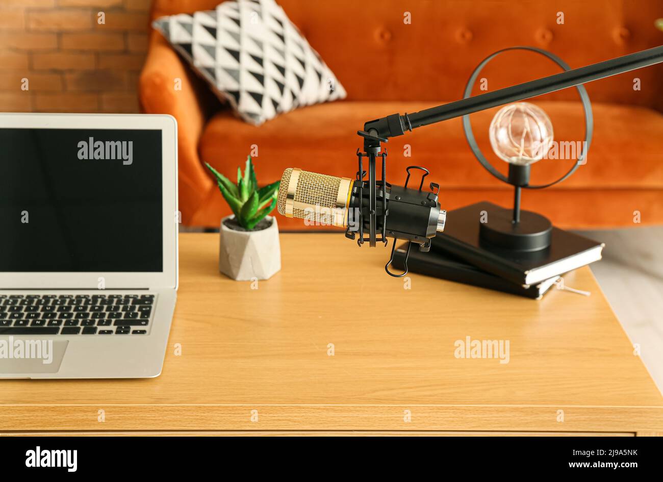 Stand with professional microphone near modern workplace in room Stock ...