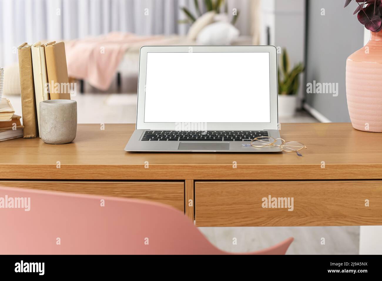 Workplace with modern laptop in room Stock Photo - Alamy