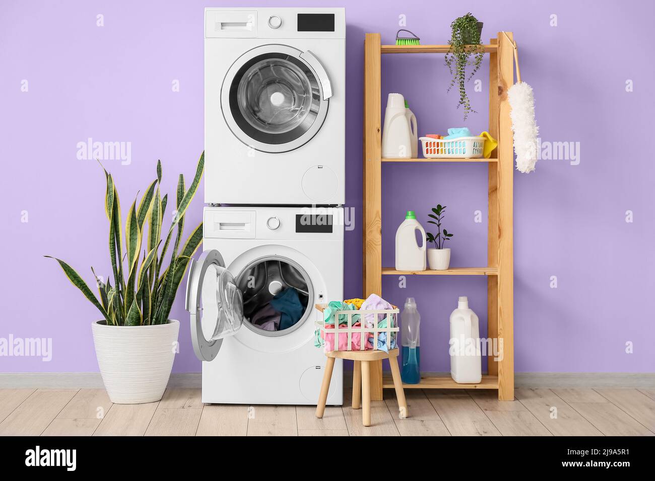 Modern drying, washing machines, basket with laundry and shelf unit ...
