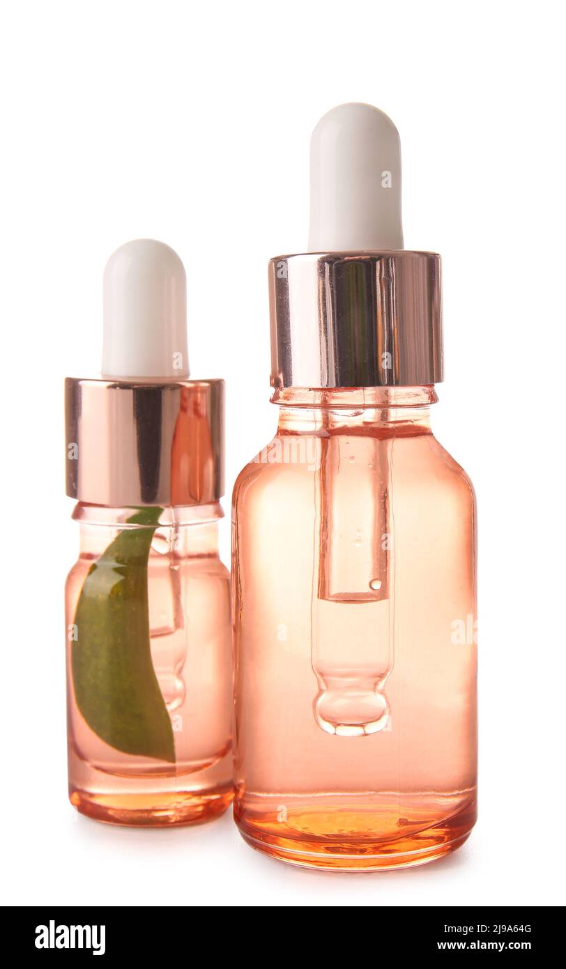 Two bottles of natural serum on white background Stock Photo - Alamy