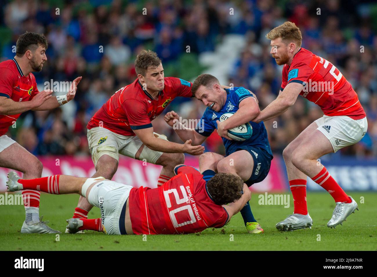 Rory O'Loughlin of Leinster tackled by Jack Daly of Munster and Alex ...
