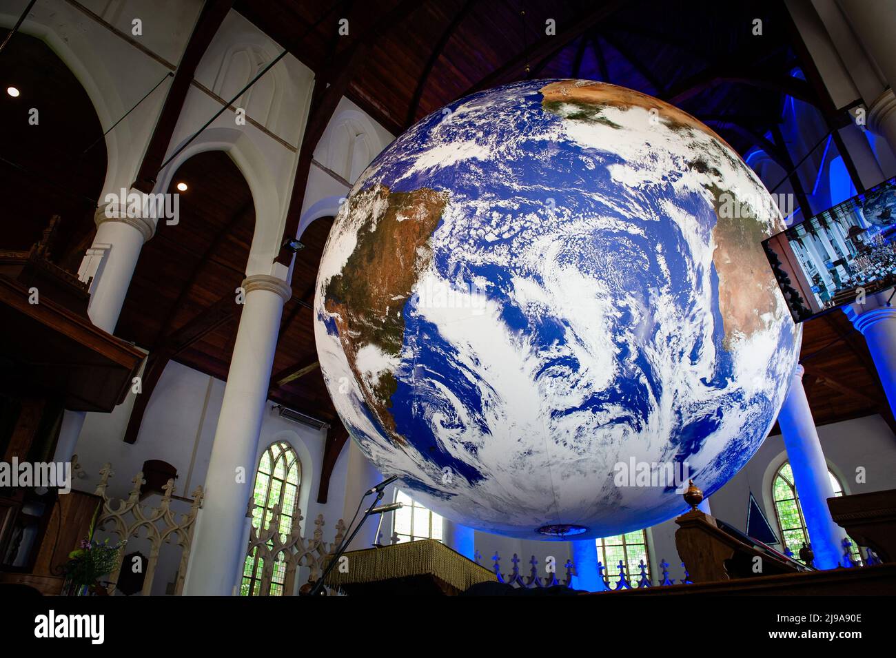 A big Earth ball is placed in the middle of a church. Gaia is a touring ...