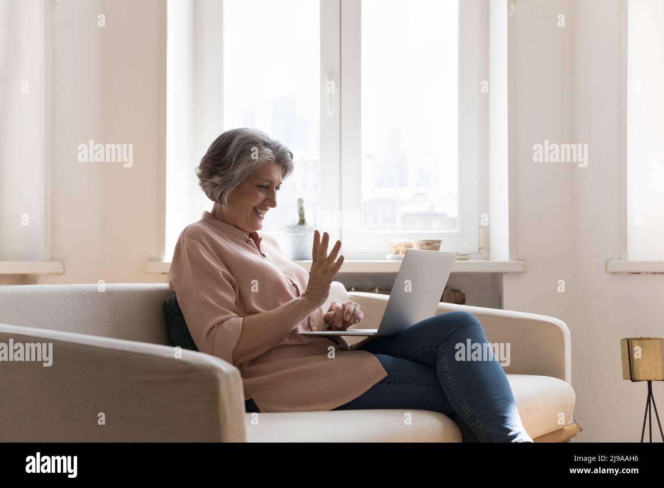 Happy cheerful mature grandma woman making video call Stock Photo - Alamy