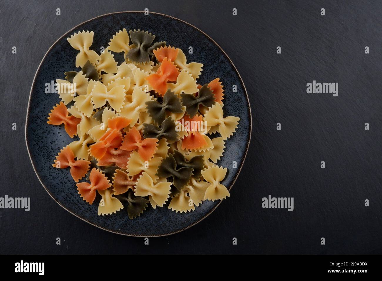 butterfly pasta is lying on a plate.farffalle Stock Photo - Alamy