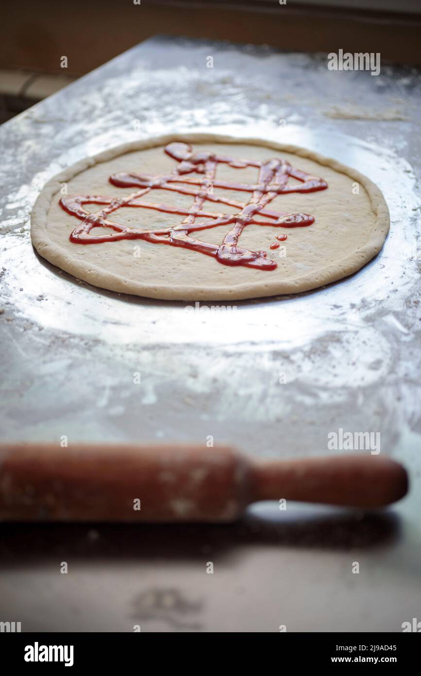 food cooking, culinary and people concept - cook or baker hand with ...