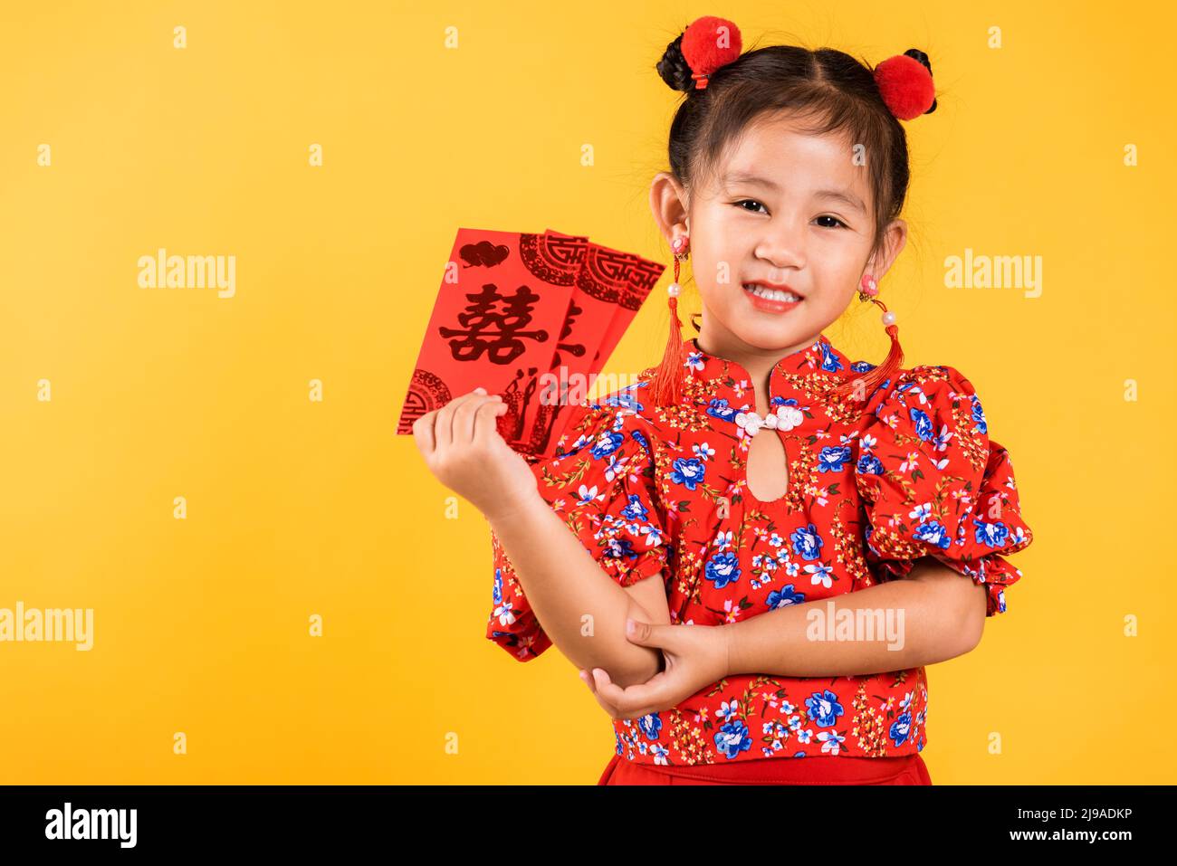 Chinese New Year. Happy Asian Chinese little girl smile wear red ...