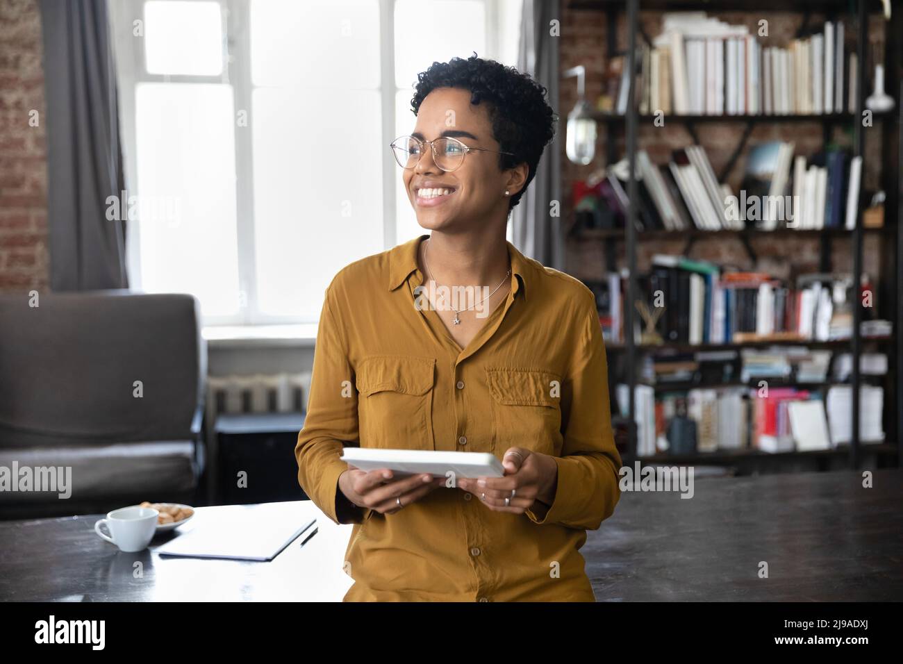 Digital device distracted african hi-res stock photography and images ...