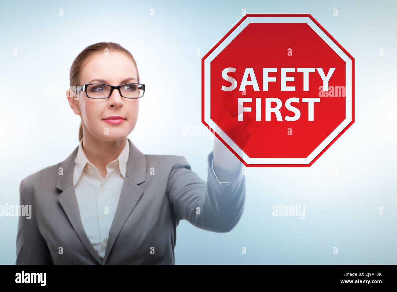 Safety first concept with the businesswoman Stock Photo - Alamy