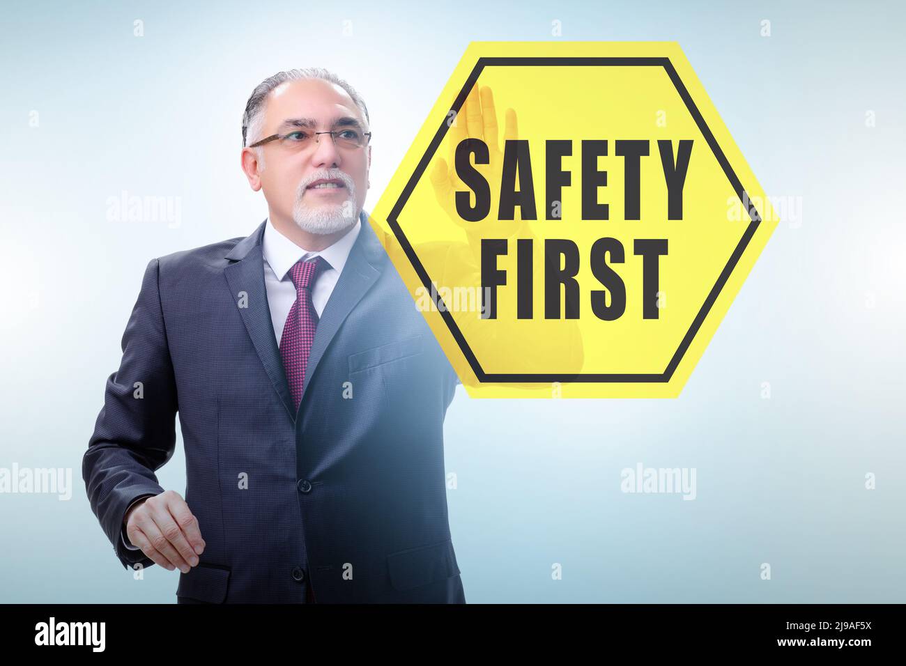 Safety first concept with the businessman Stock Photo - Alamy