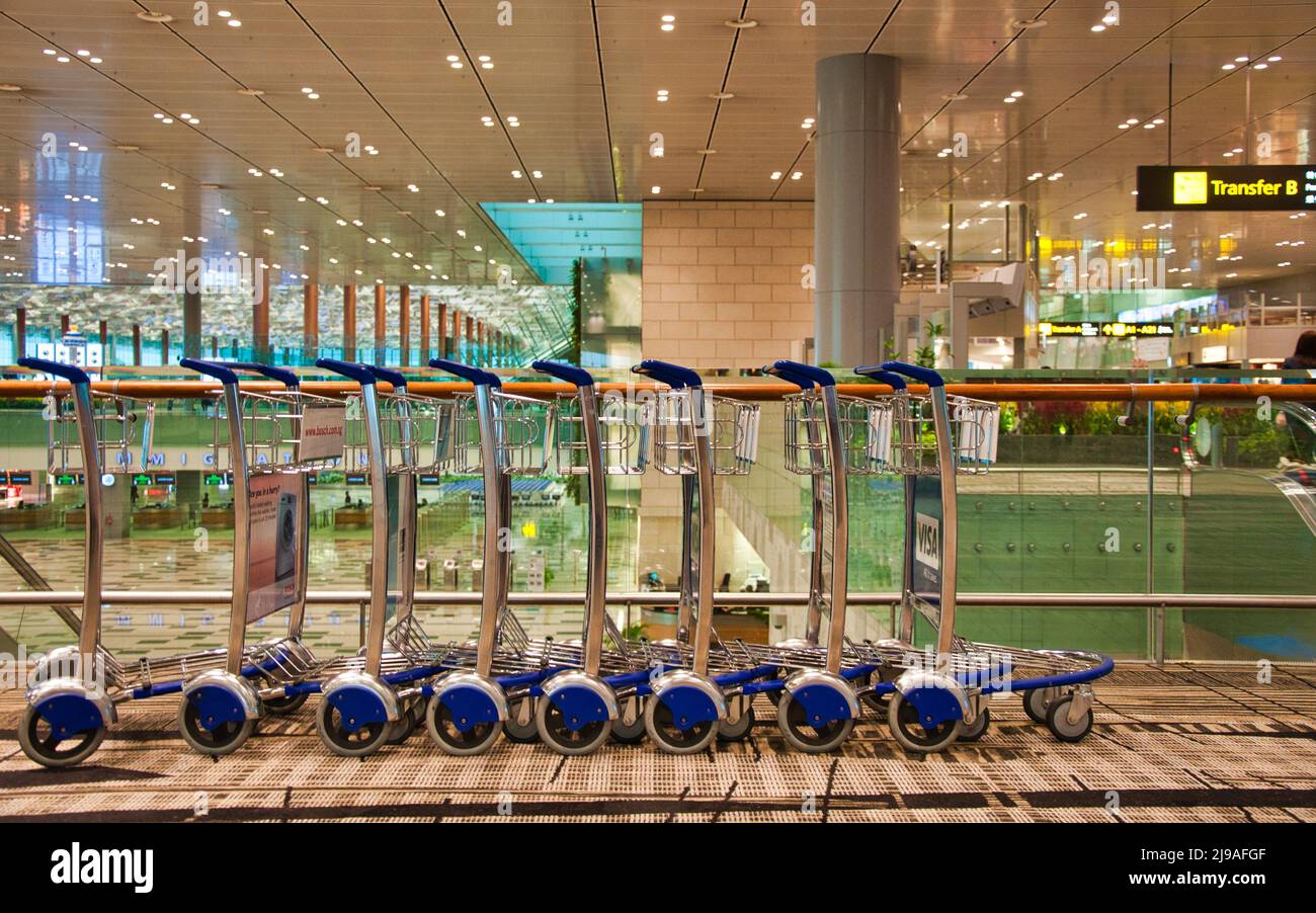 Luggage trolleys in the airport Stock Photo - Alamy