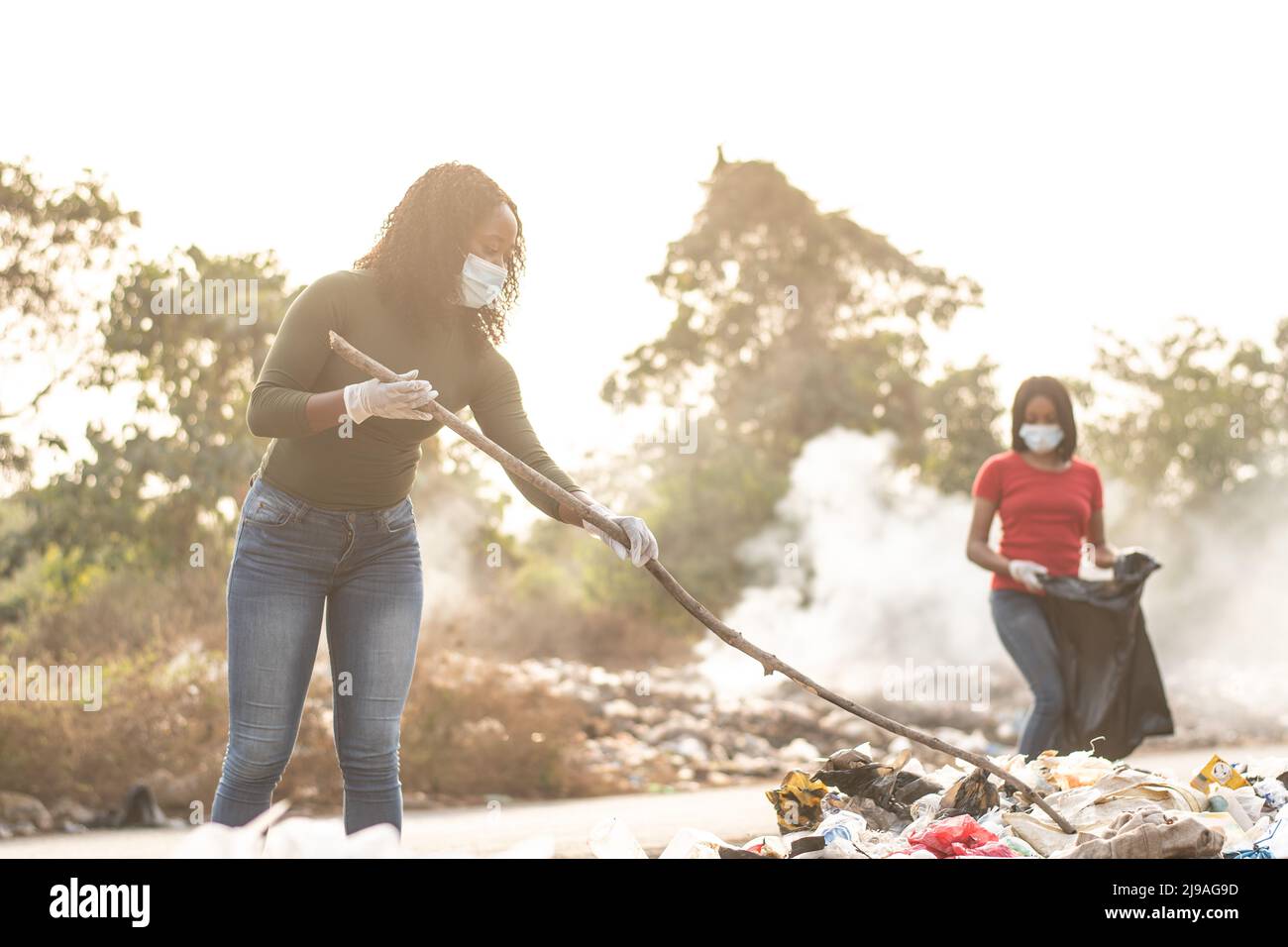 black women cleaning up a dirty place Stock Photo - Alamy