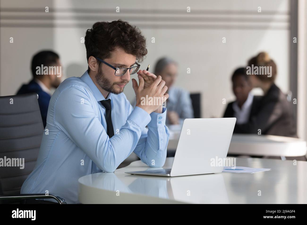 Businessman working on market research sit at desk with laptop Stock ...