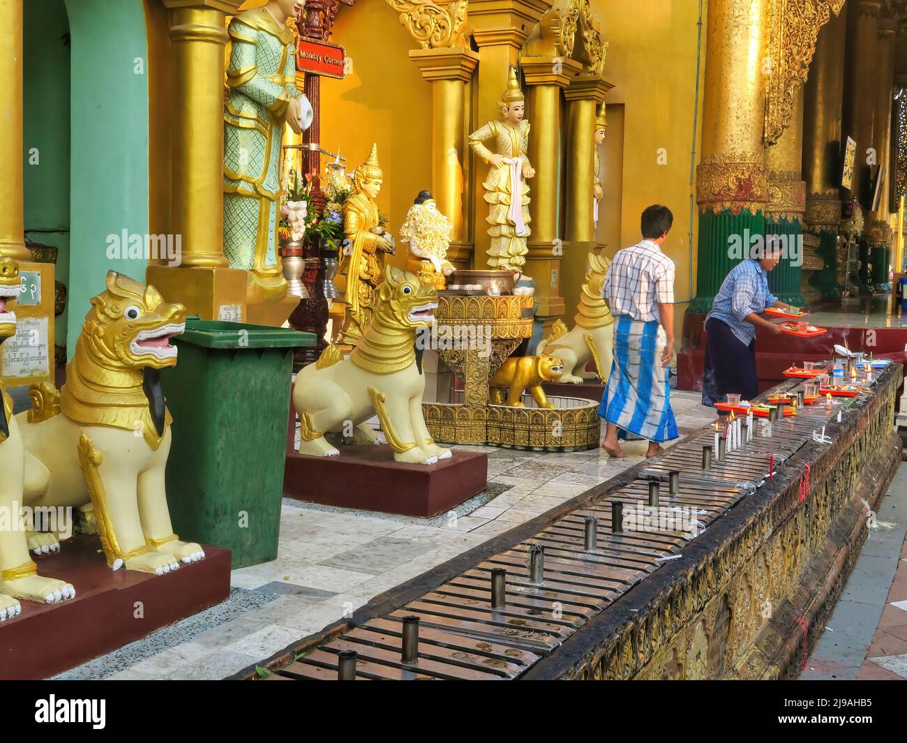 Yangon, Myanmar - April 24, 2018: Buddhist Woman Placing Offerings on ...