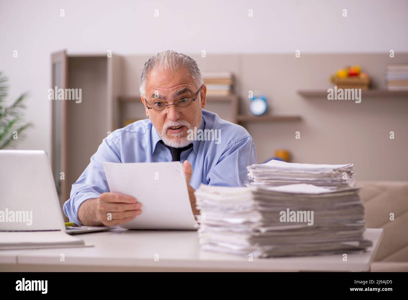 Old boss working from home during pandemic Stock Photo - Alamy