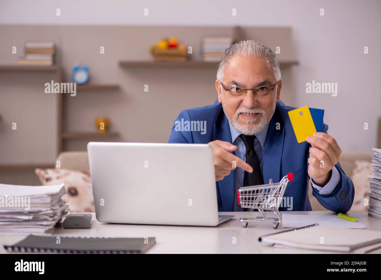 Old boss working from home during pandemic Stock Photo - Alamy